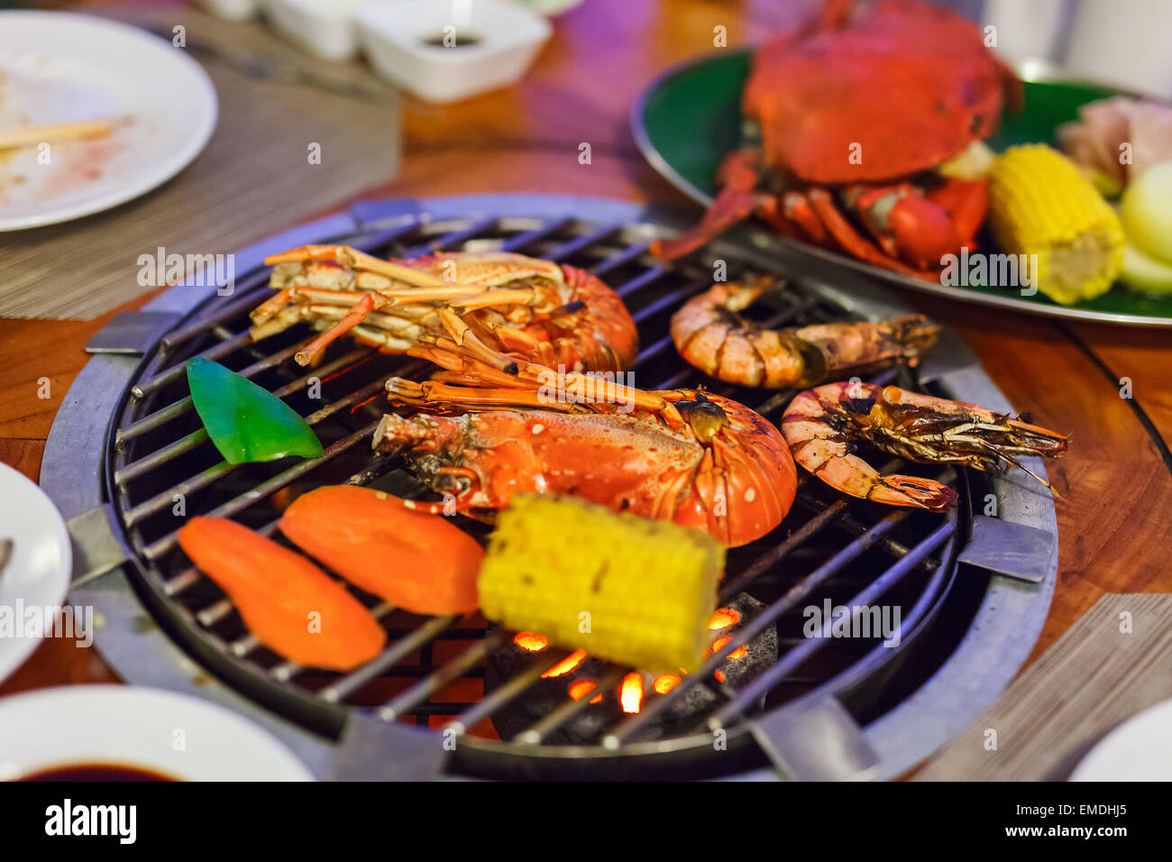 Seafood at grill Stock Photo - Alamy