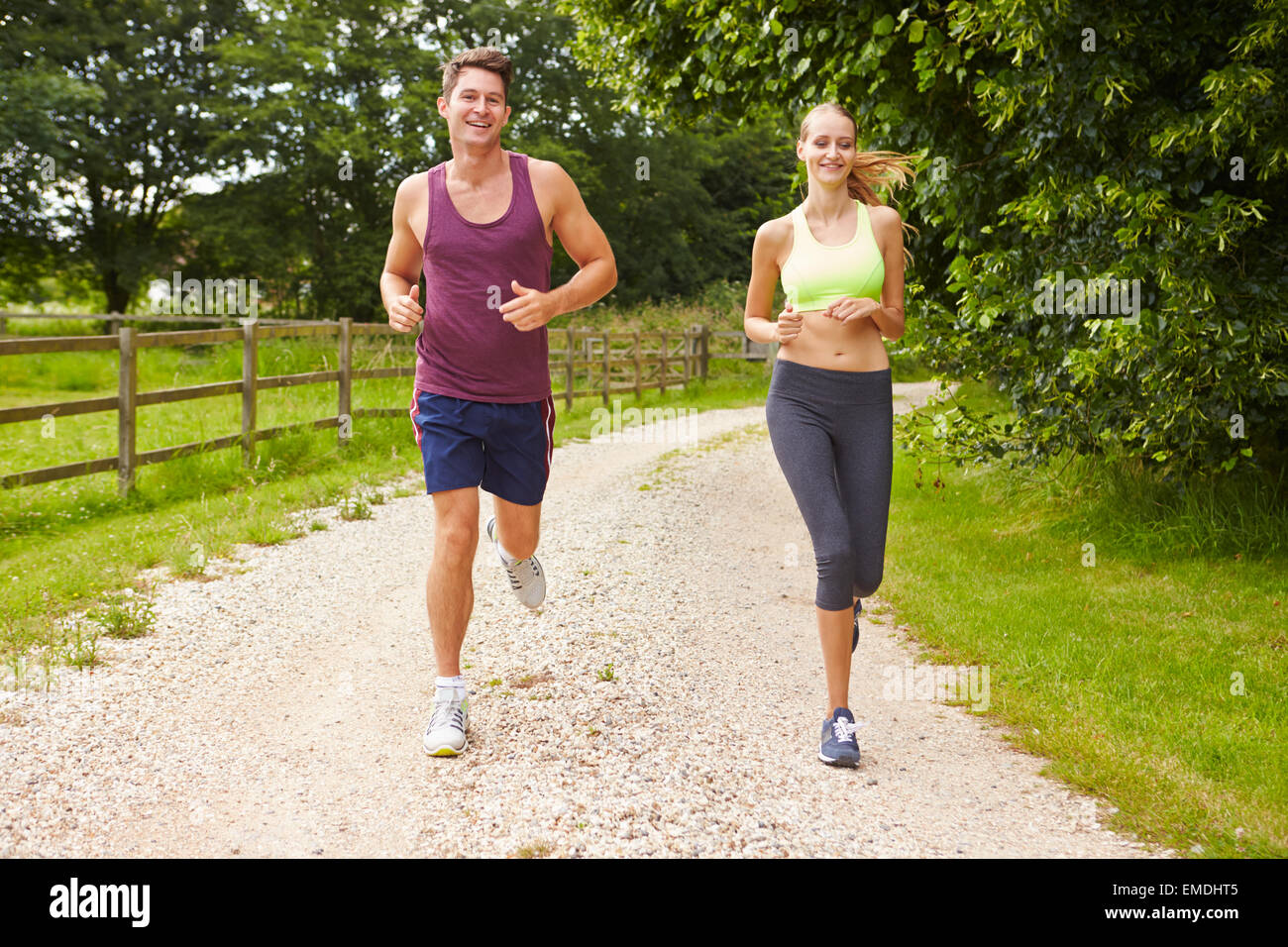 Couple On Run In Countryside Together Stock Photo - Alamy