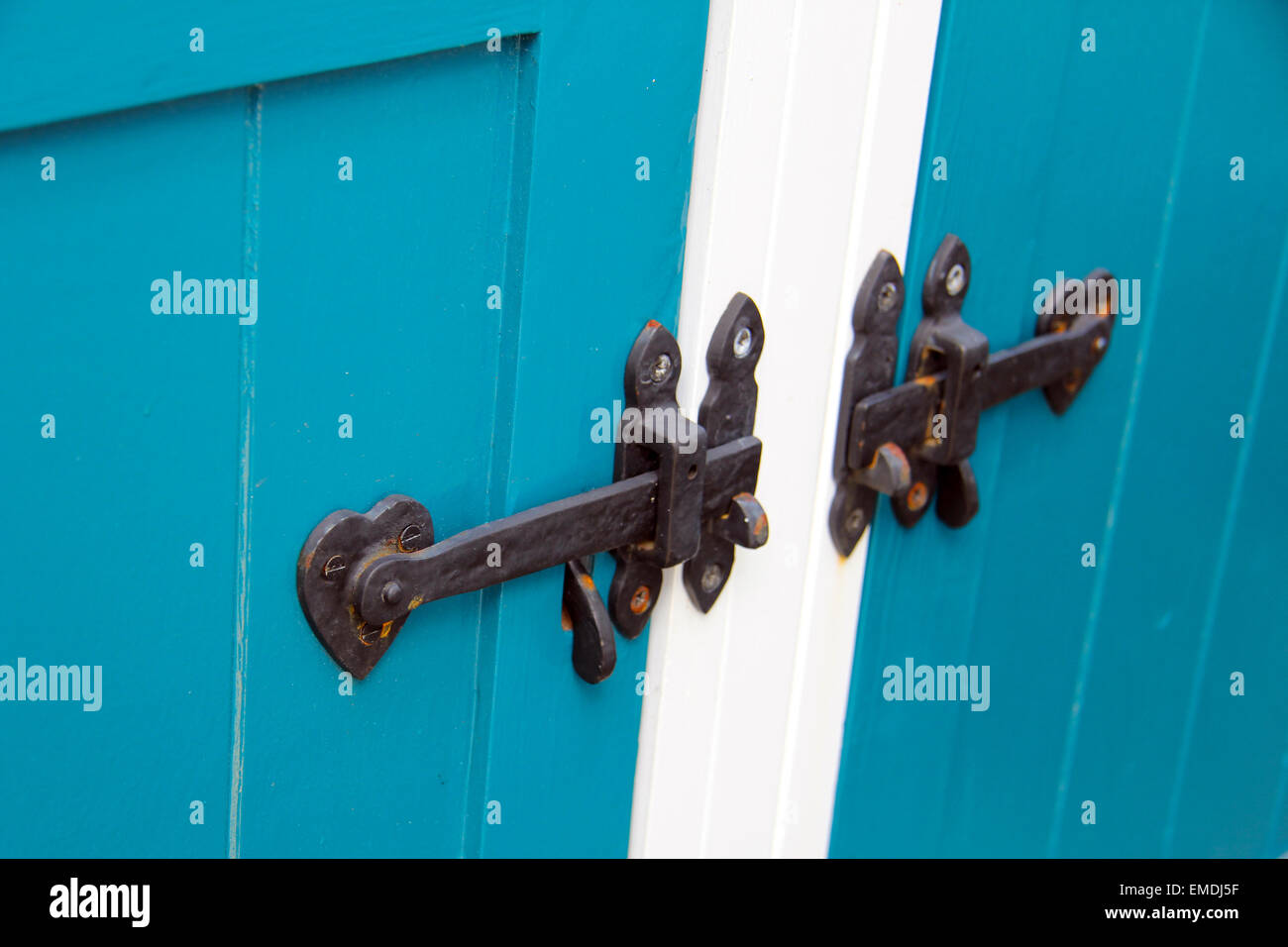 Blue door latch Stock Photo - Alamy