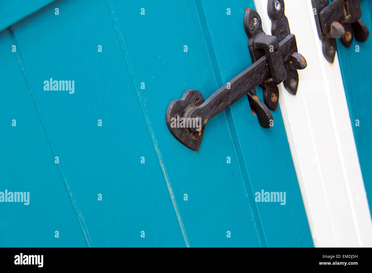 Blue door latch Stock Photo - Alamy