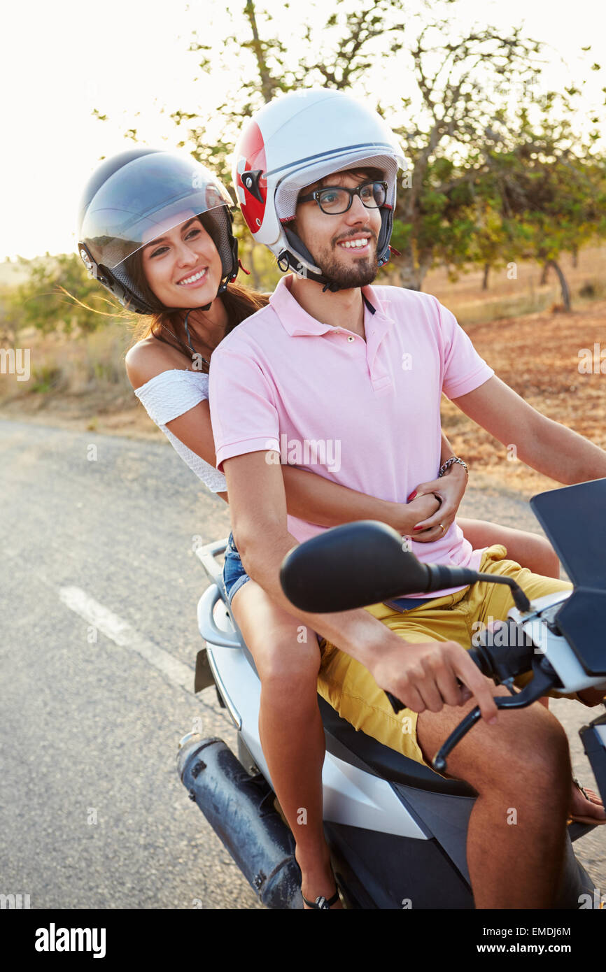 Couple driving scooter having hi-res stock photography and images - Alamy