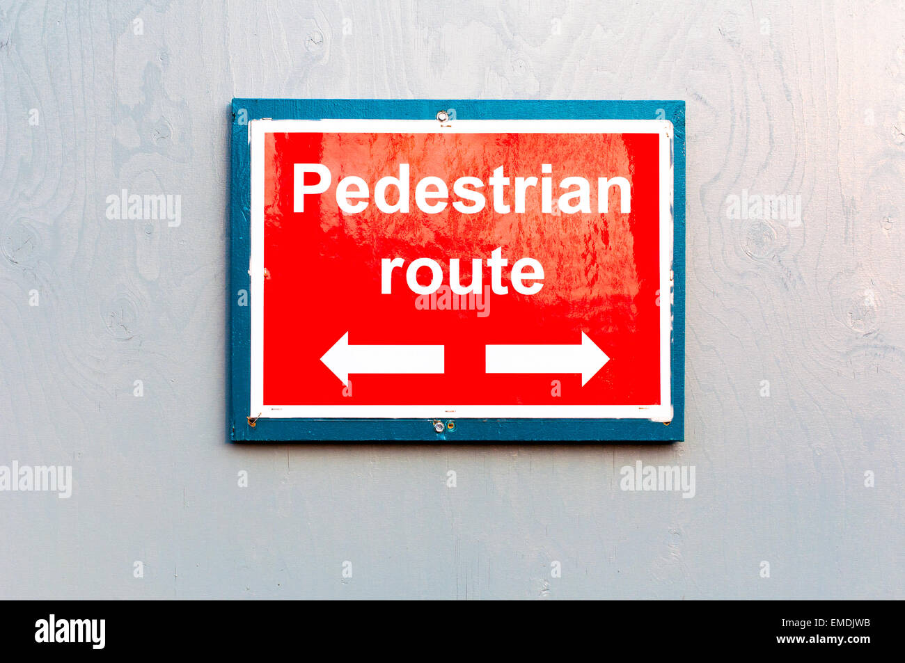 Pedestrian route direction notice board with reflection Stock Photo - Alamy