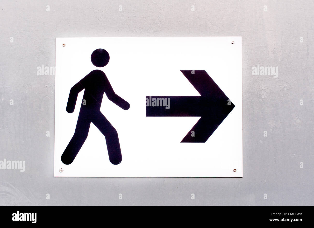 Pedestrian route direction icon and direction on white painted notice ...