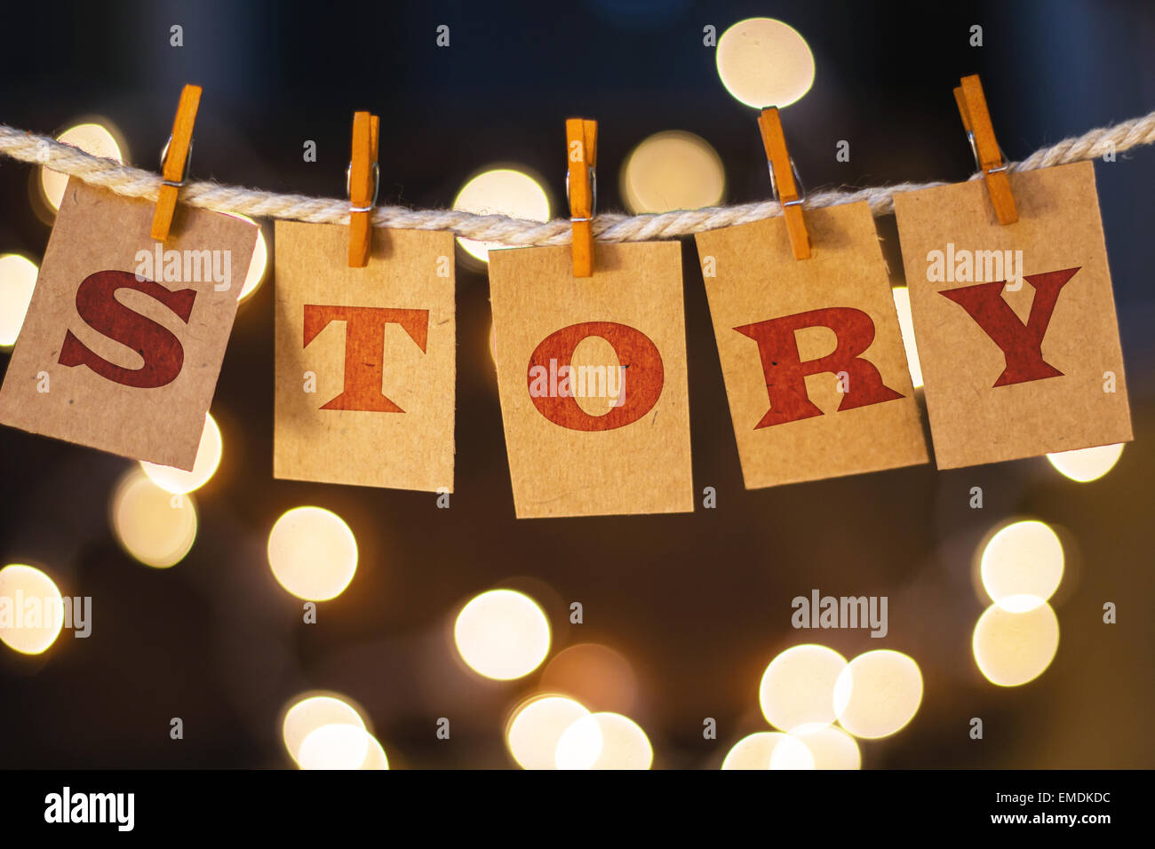 The Word STORY Printed On Clothespin Clipped Cards In Front Of the-word-story-printed-on-clothespin-clipped-cards-in-front-of