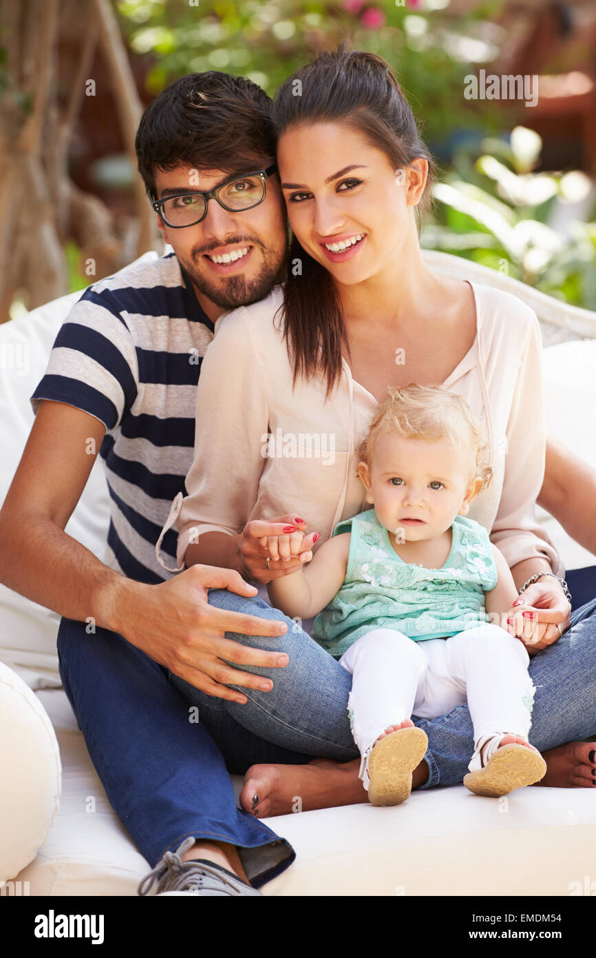 Family Sitting Outdoors In Garden At Home Together Stock Photo - Alamy