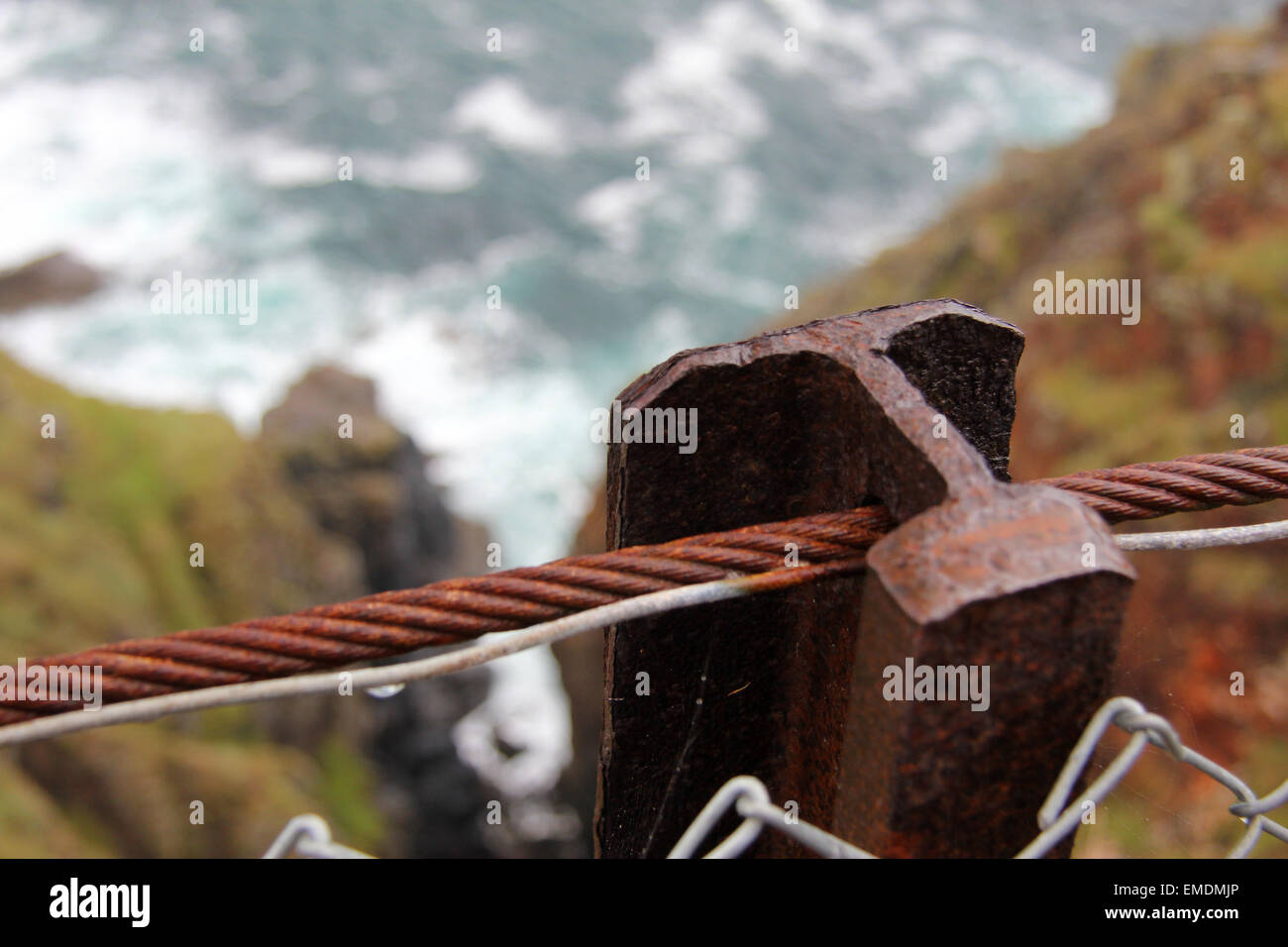 Rusted cable and beach Stock Photo - Alamy