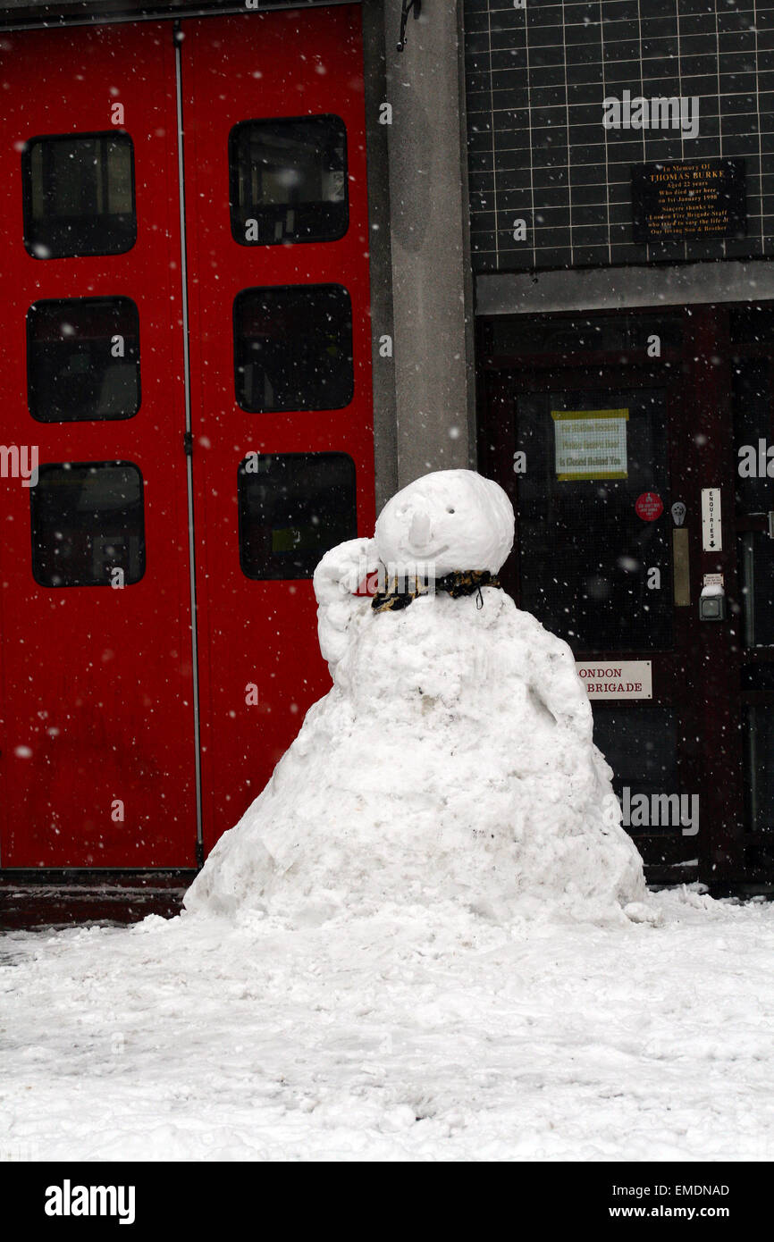 Snowman by fire station Stock Photo - Alamy