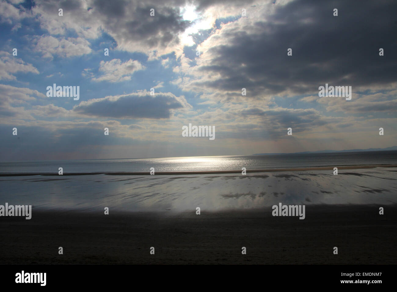 Sun rays on beach Stock Photo - Alamy