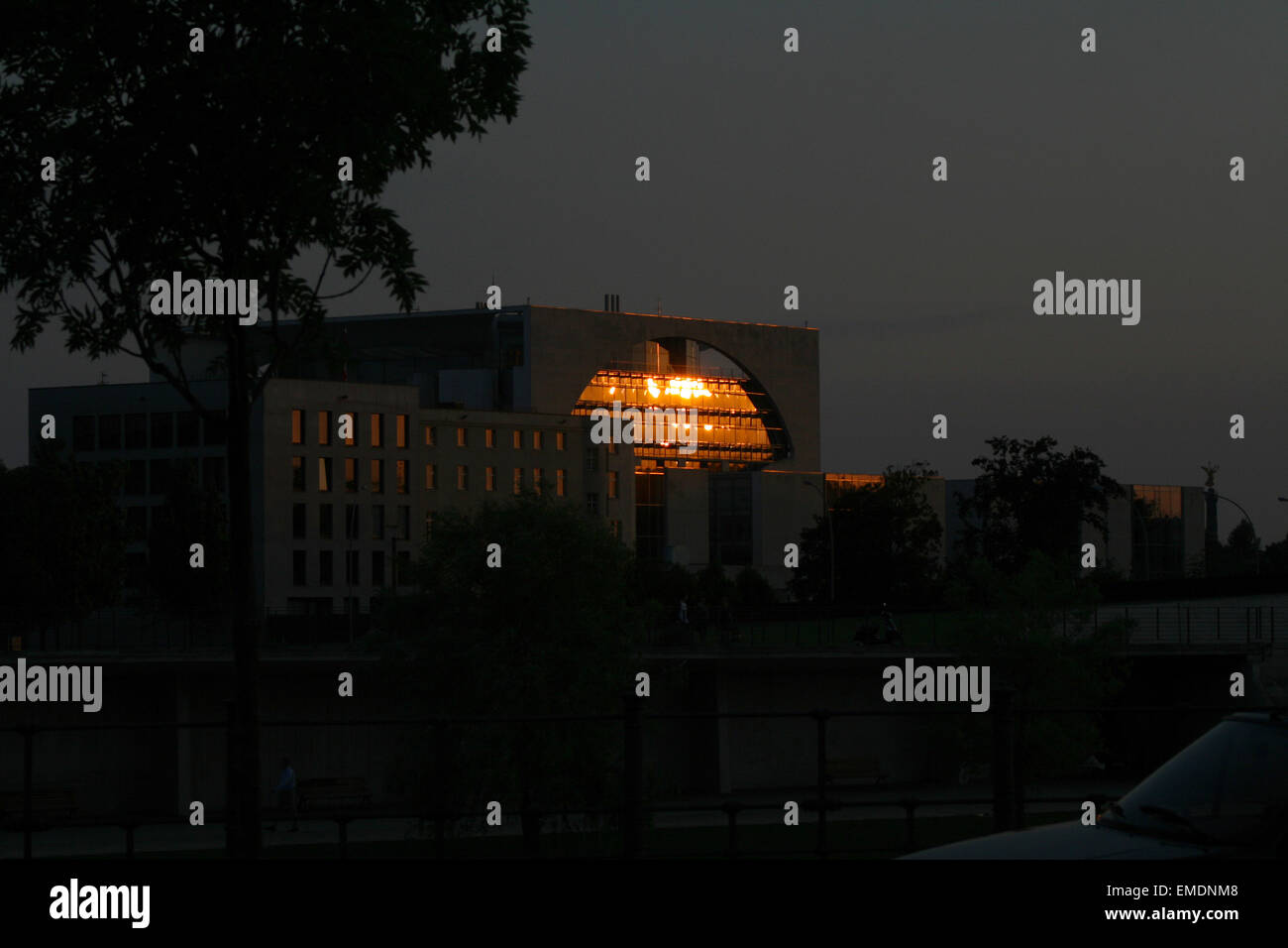 Sunset reflecting on building Stock Photo - Alamy