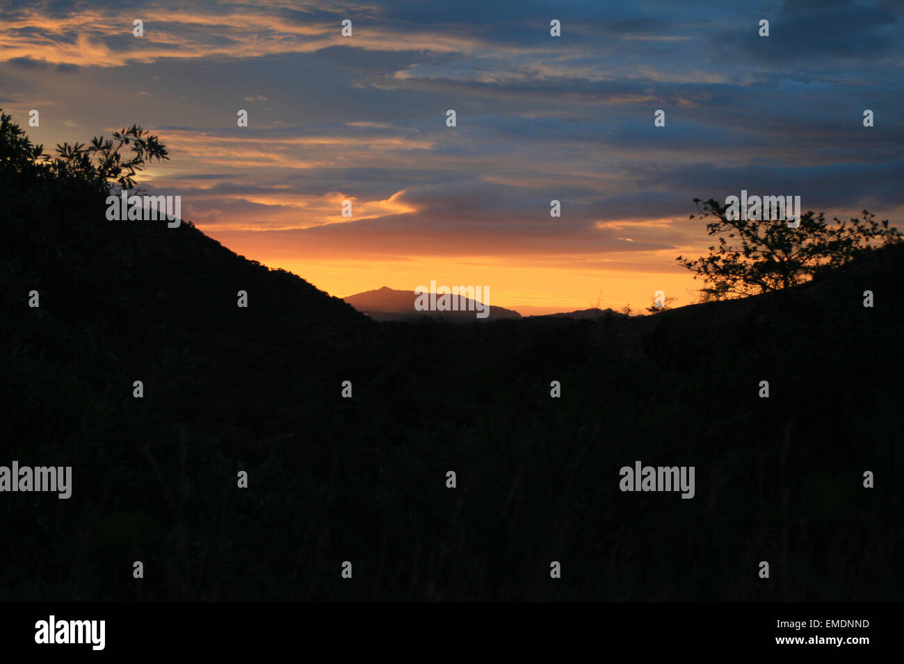 Sunset over mountains Stock Photo - Alamy