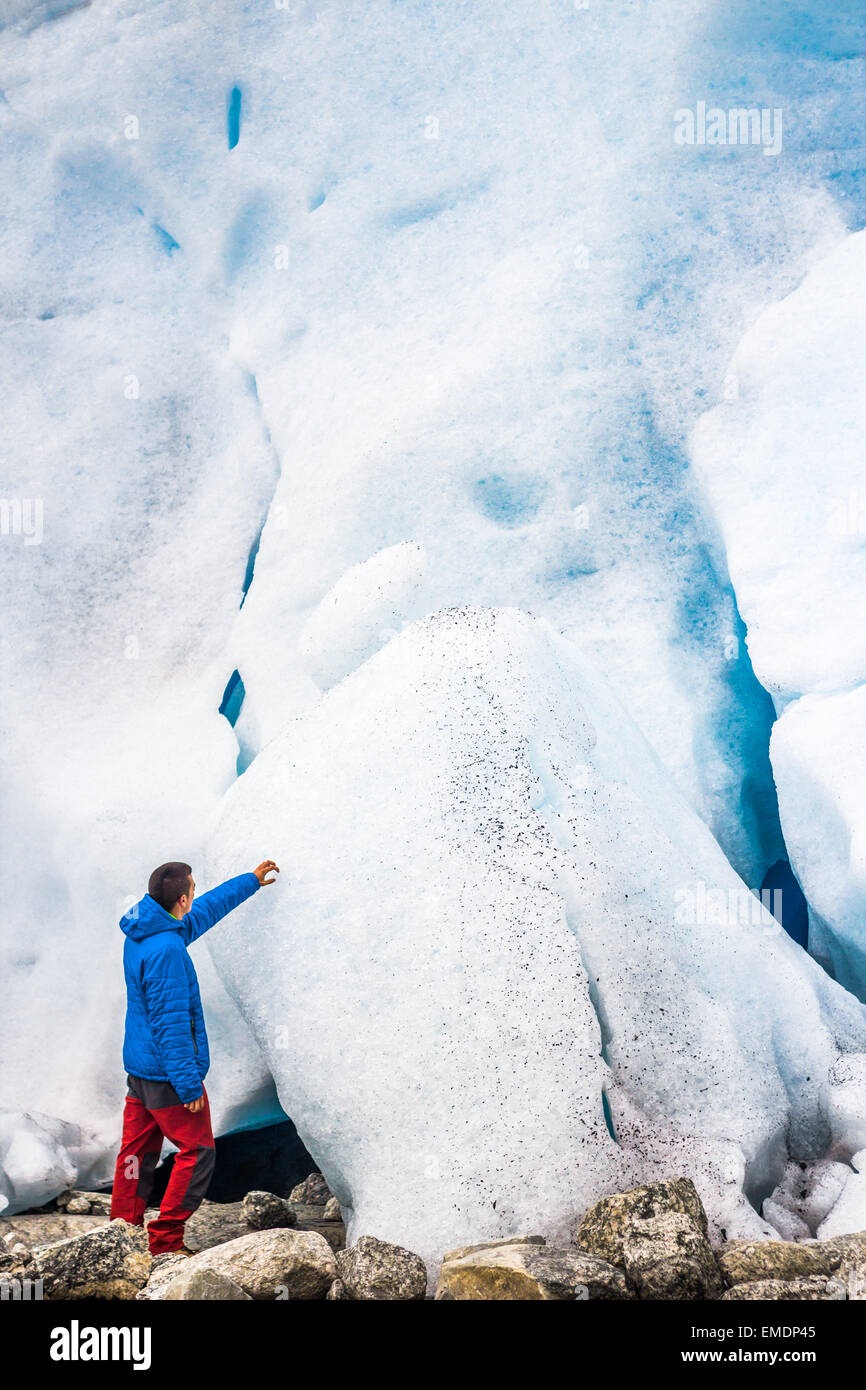 Man touching a glacier Stock Photo - Alamy