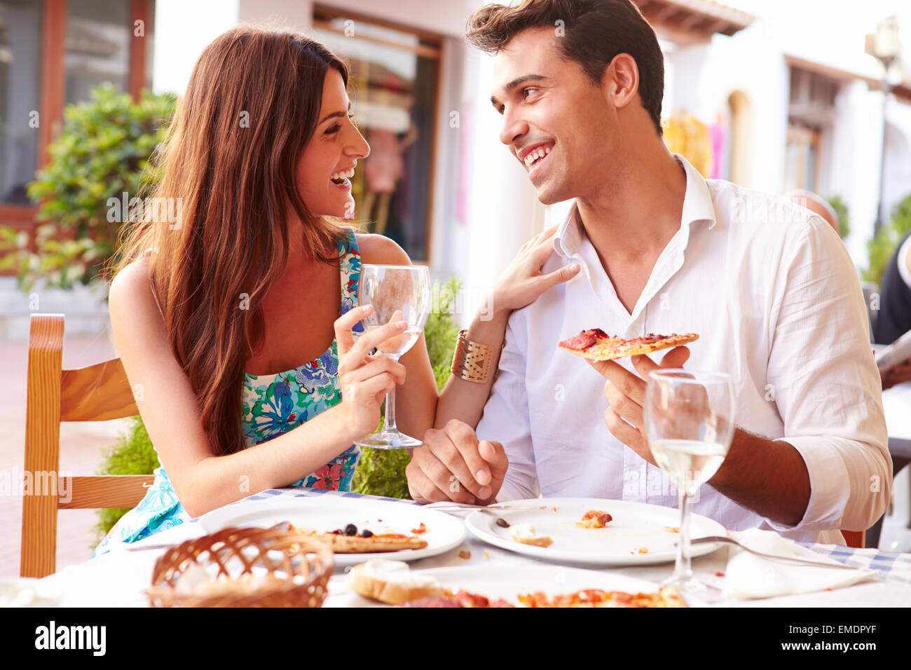 Young Couple Eating Meal Outdoors Together Stock Photo - Alamy