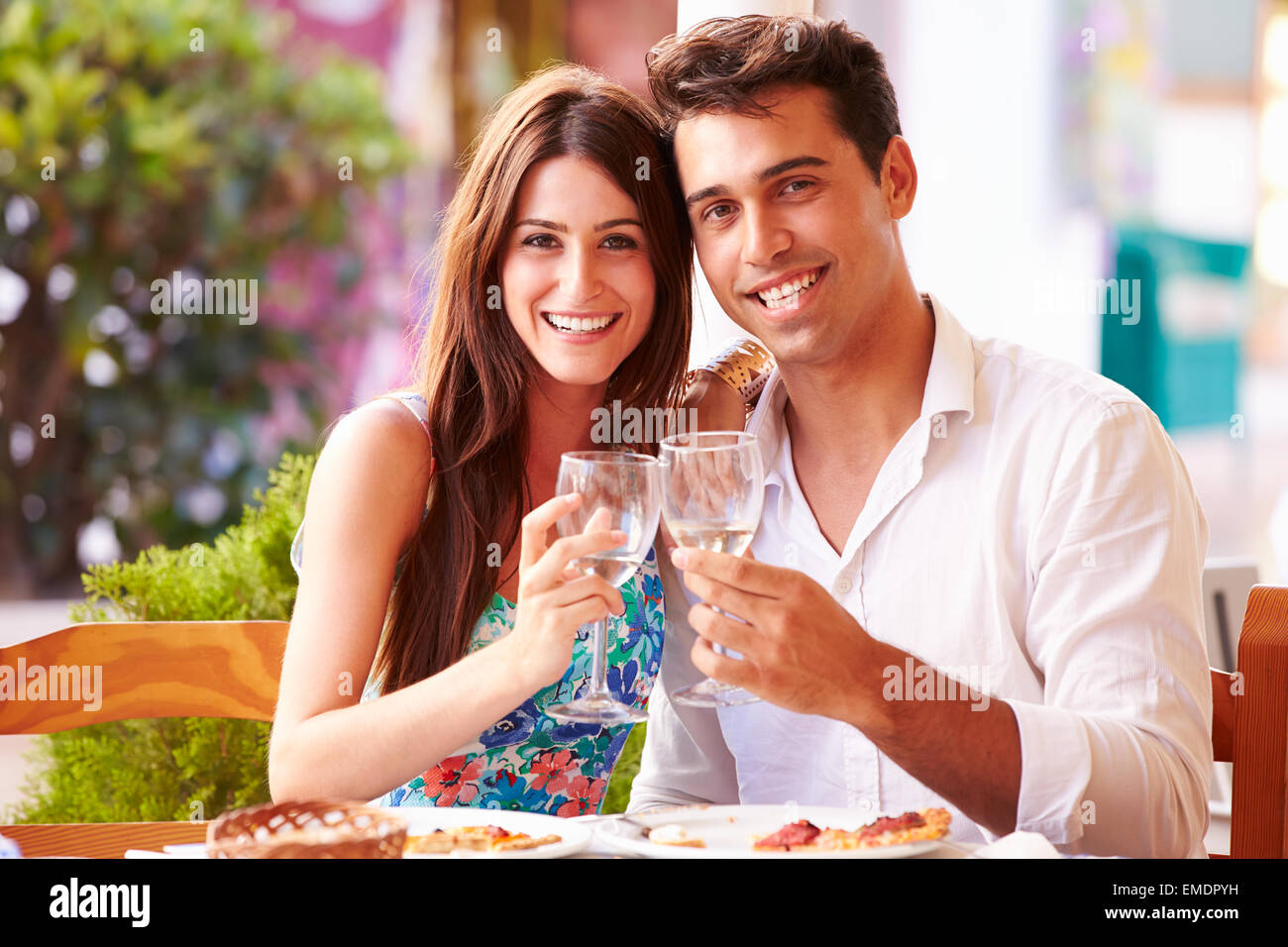 Young Couple Eating Meal Outdoors Together Stock Photo - Alamy