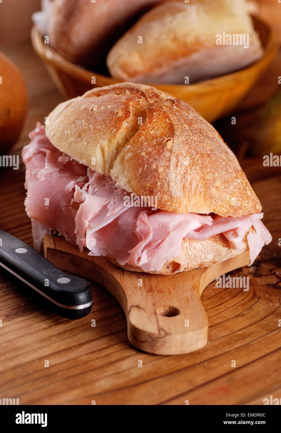 ham sandwich on wooden chopping board Stock Photo - Alamy