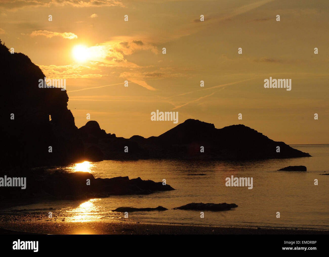 North Devon View The setting sun at Hele Bay near Ilfracombe North ...