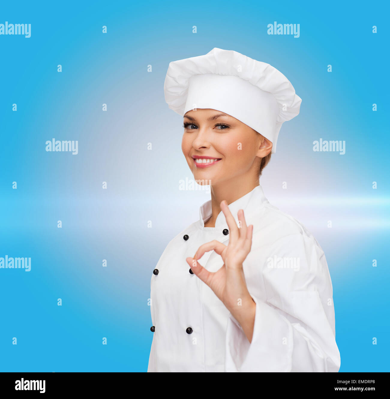smiling female chef showing ok hand sign Stock Photo - Alamy