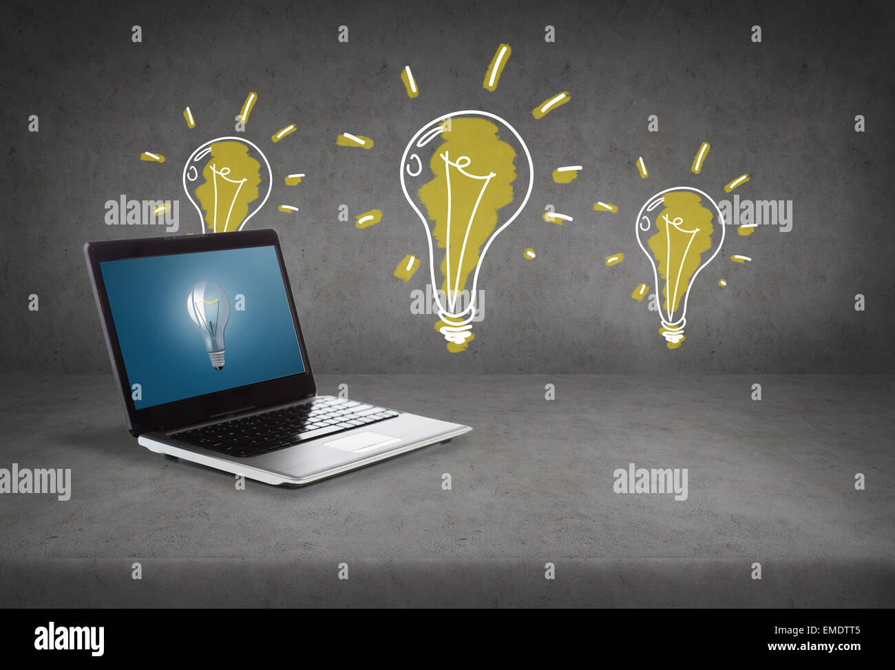 laptop computer with light bulb on screen Stock Photo - Alamy
