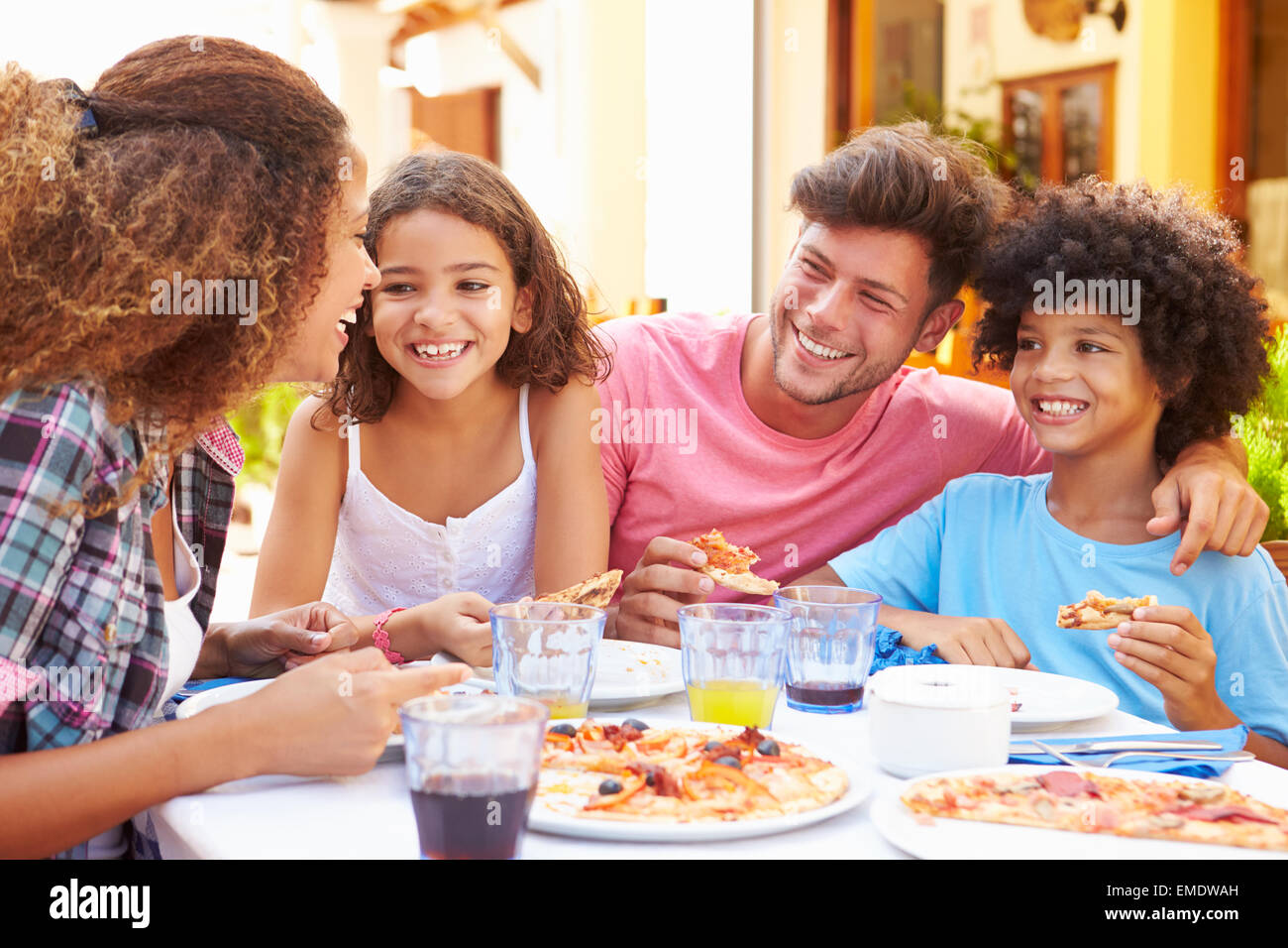 Family Eating Meal At Outdoor Restaurant Together Stock Photo - Alamy