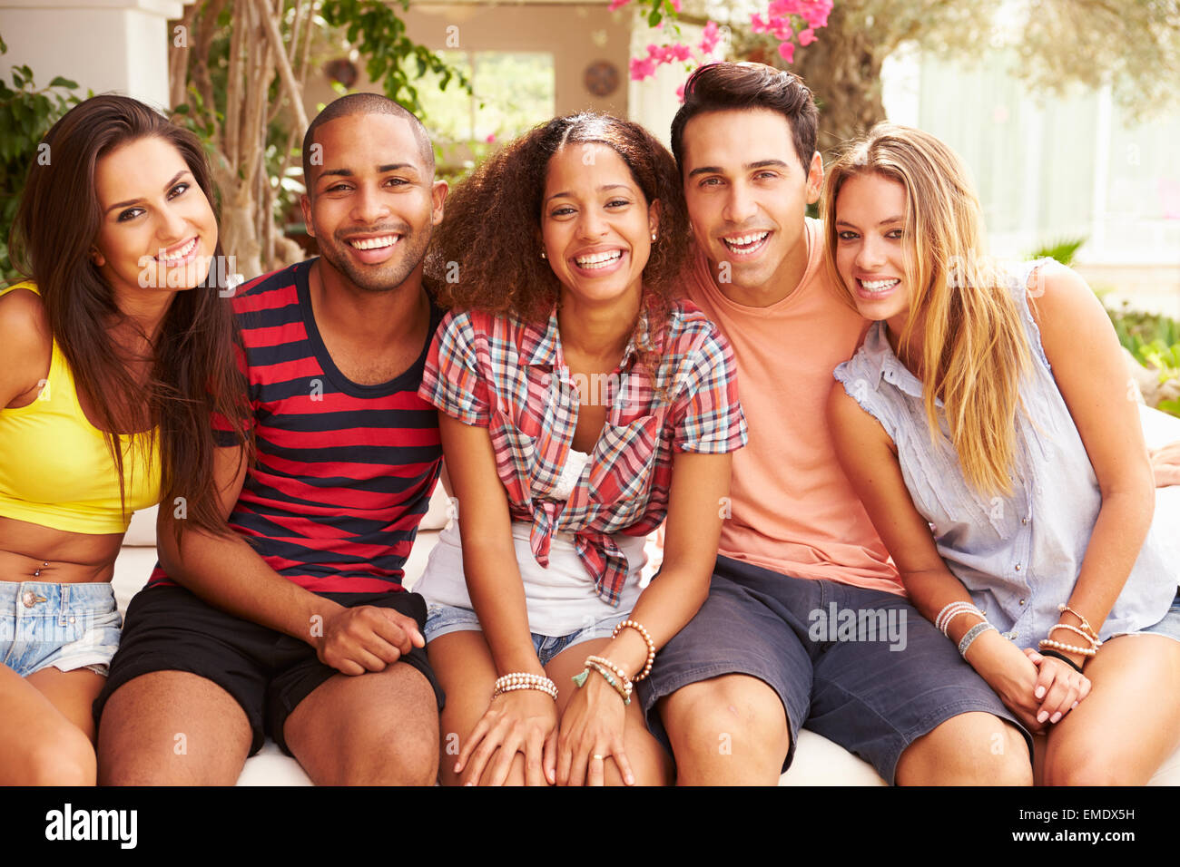 Group Of Friends Relaxing Outdoors On Holiday Together Stock Photo - Alamy