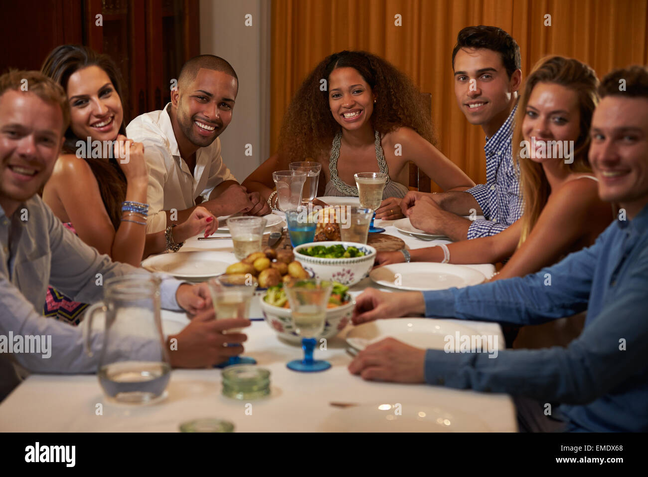 Group Of Friends Enjoying Dinner Party At Home Together Stock Photo - Alamy