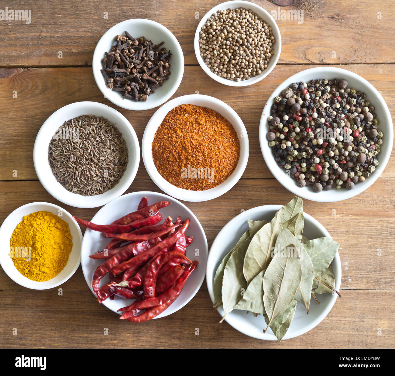 set of spices on wooden table Stock Photo - Alamy