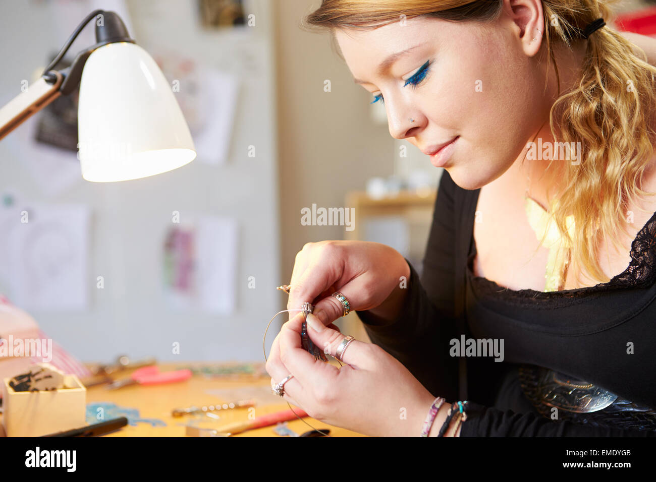 Young Woman Making Jewelry At Home Stock Photo - Alamy