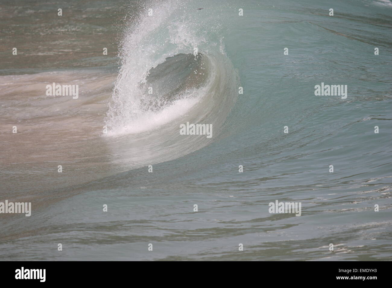 Ocean surf Wave Barrel curling before crashing Stock Photo - Alamy