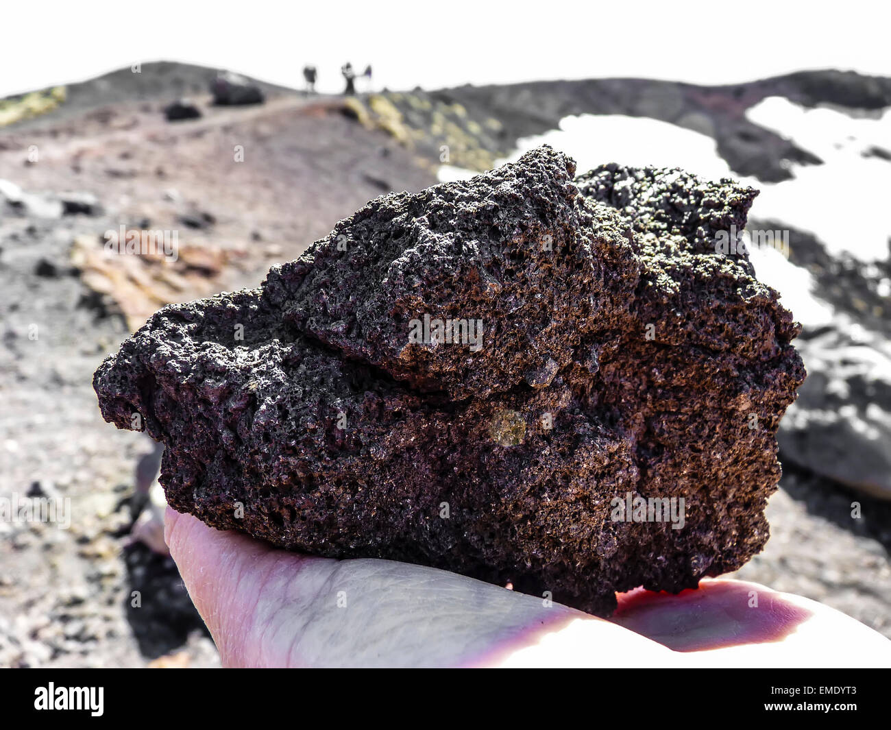Volcanic rock in human hand at mount Etna, Sicily, Italy Stock Photo ...