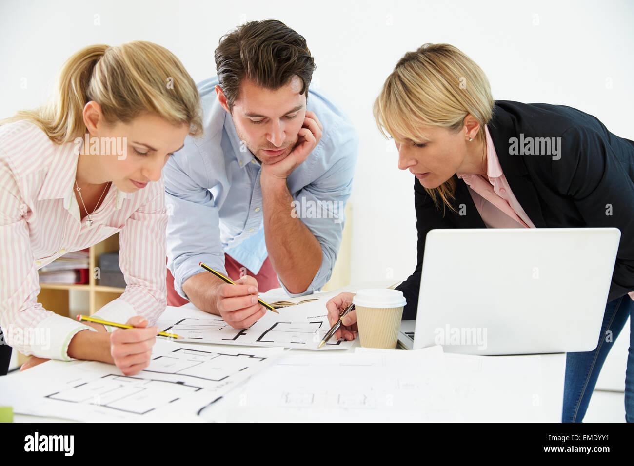 Architects Planning Layout Of Empty Office Space Stock Photo - Alamy