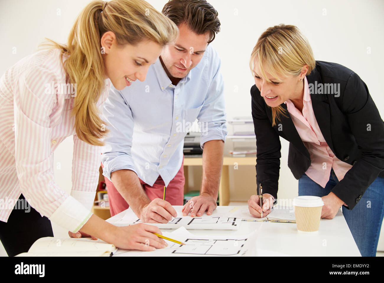 Architects Planning Layout Of Empty Office Space Stock Photo - Alamy