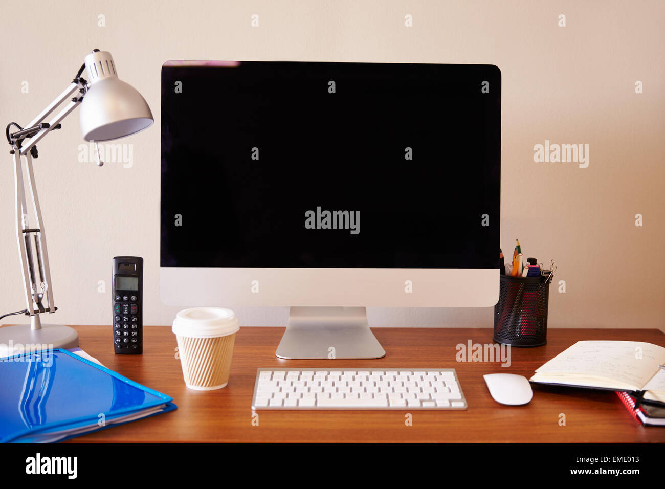 Computer On Desk In Home Office Stock Photo - Alamy