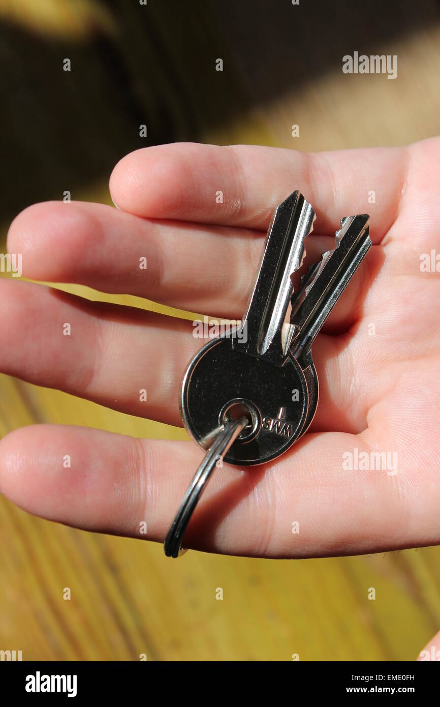 hands holds door key Stock Photo - Alamy