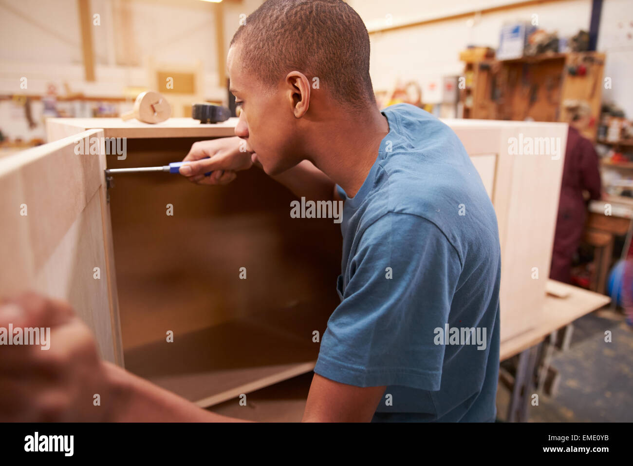 Apprentice Building Furniture In Carpentry Workshop Stock Photo - Alamy