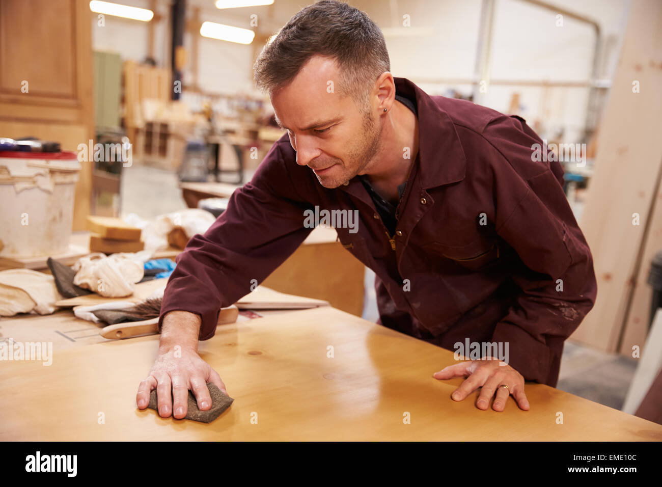 Carpenter Finishing Wood In Carpentry Workshop Stock Photo - Alamy