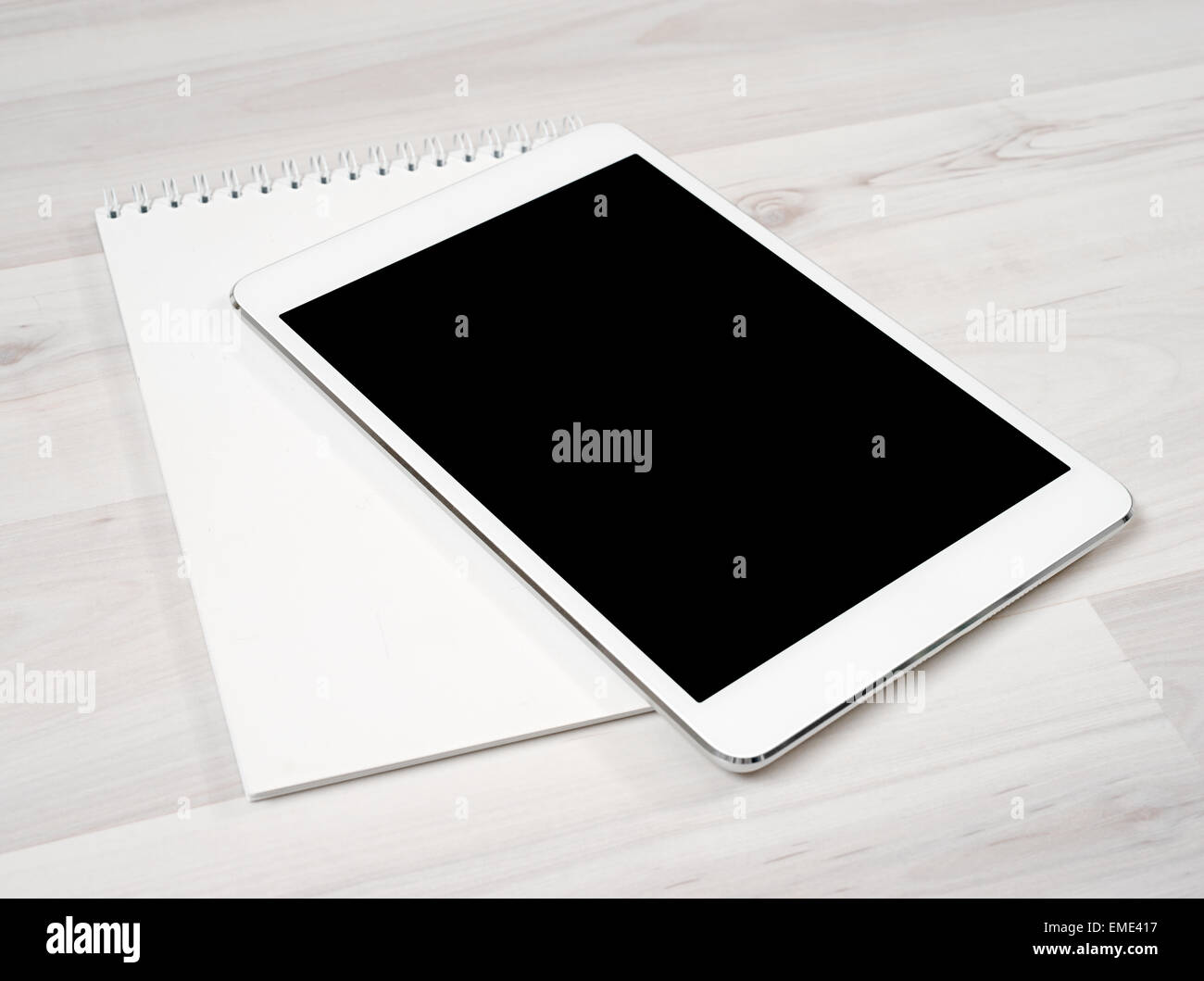 White digital tablet with pen and notebook on the table Stock Photo - Alamy