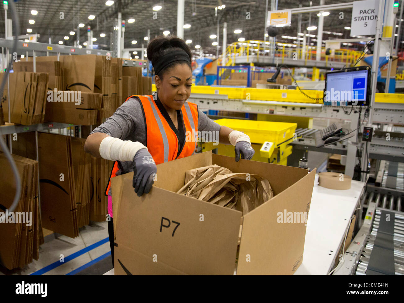 woman employee working at the 1.25 million square foot Amazon shipping ...