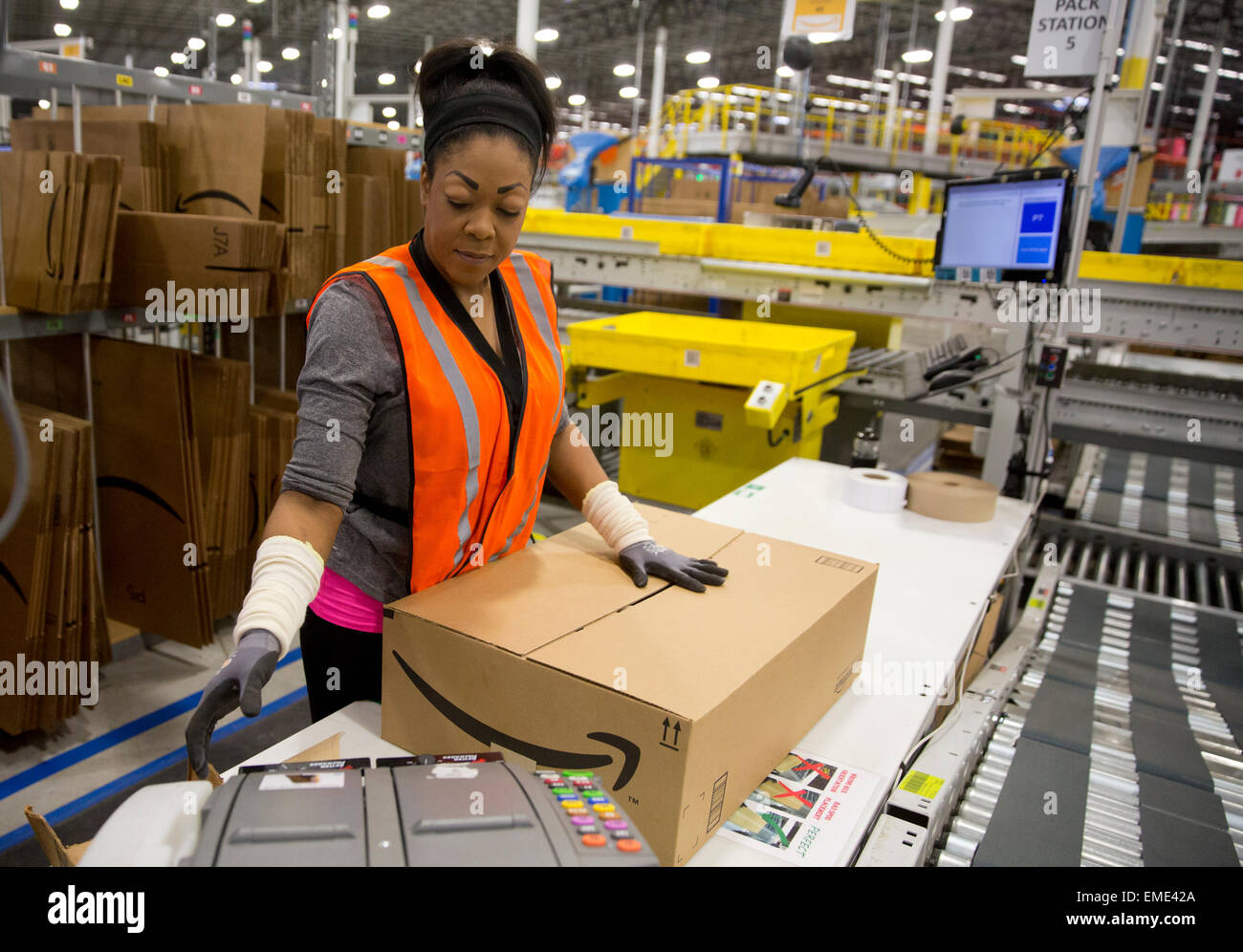 woman employee working at the 1.25 million square foot Amazon shipping ...