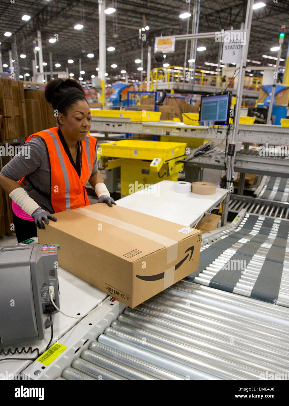 woman employee working at the 1.25 million square foot Amazon shipping ...