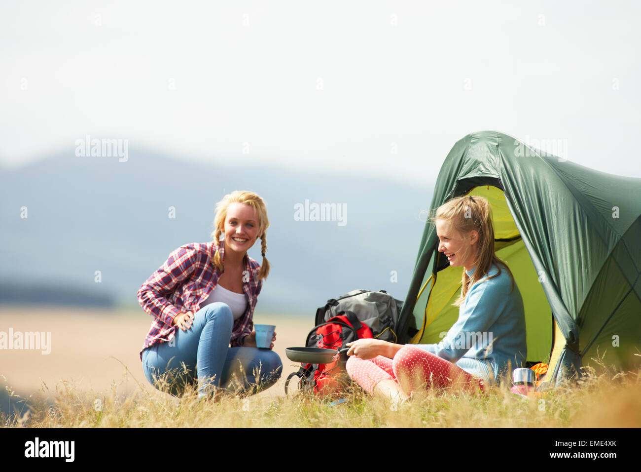 Two Teenage Girls On Camping Trip In Countryside Stock Photo - Alamy