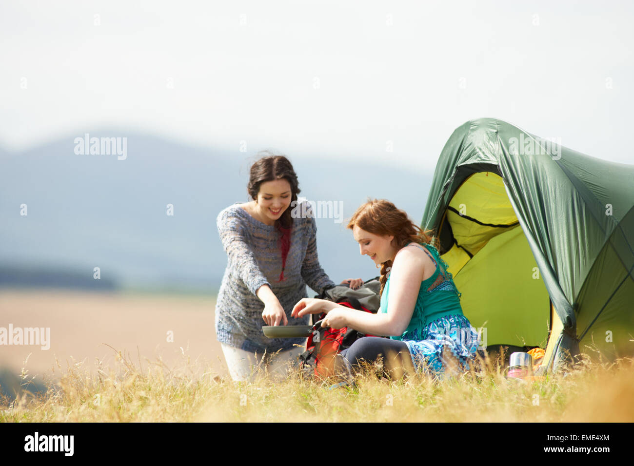 Two Teenage Girls On Camping Trip In Countryside Stock Photo - Alamy