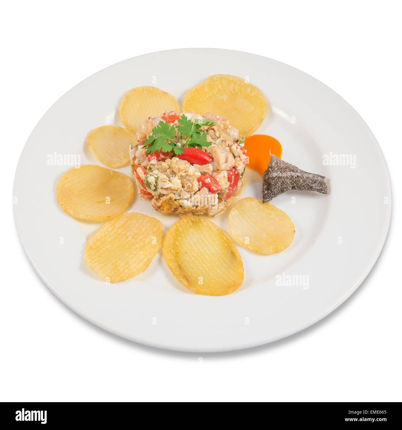 Dish of cod, potato, egg and red pepper Stock Photo - Alamy