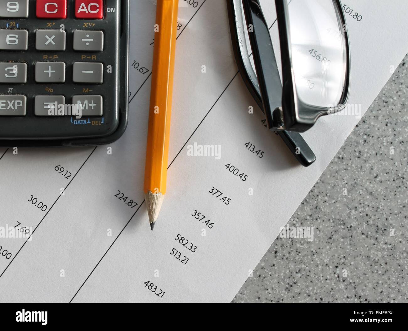 Bank statement with pencil and calculator Stock Photo - Alamy