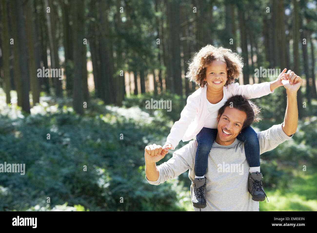 Father Giving Daughter Ride On Shoulders In Countryside Stock Photo - Alamy