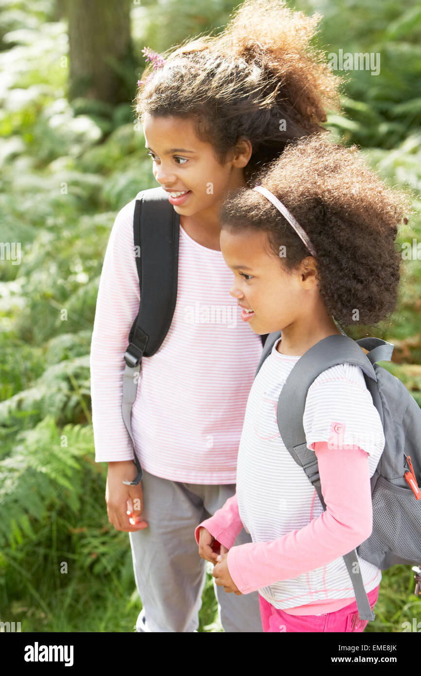 Two Girls Exploring Woods Together Stock Photo - Alamy