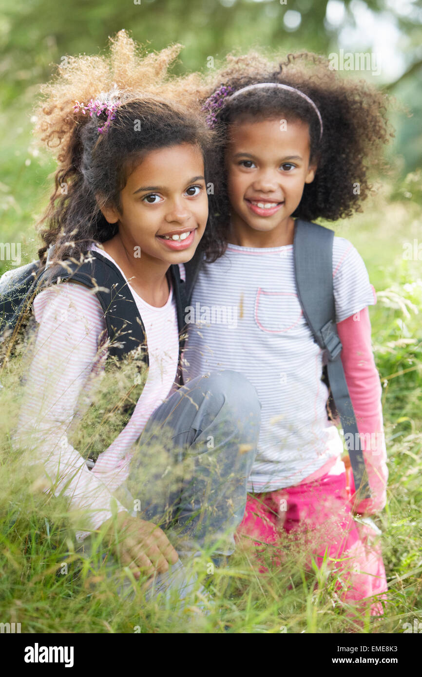 Two Girls Exploring Woods Together Stock Photo - Alamy
