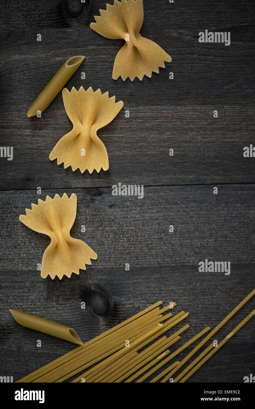 Pasta collection on rustic dark wooden background Stock Photo - Alamy