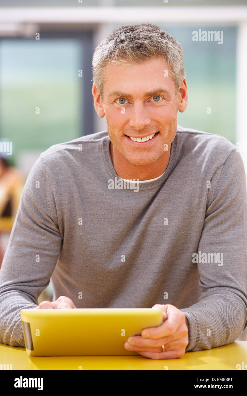 Mature Student Studying In Classroom With Digital Tablet Stock Photo ...