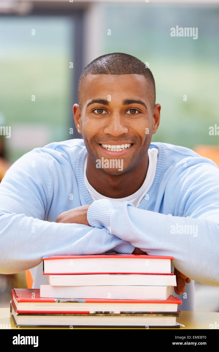 Male Student Studying In Classroom With Books Stock Photo - Alamy