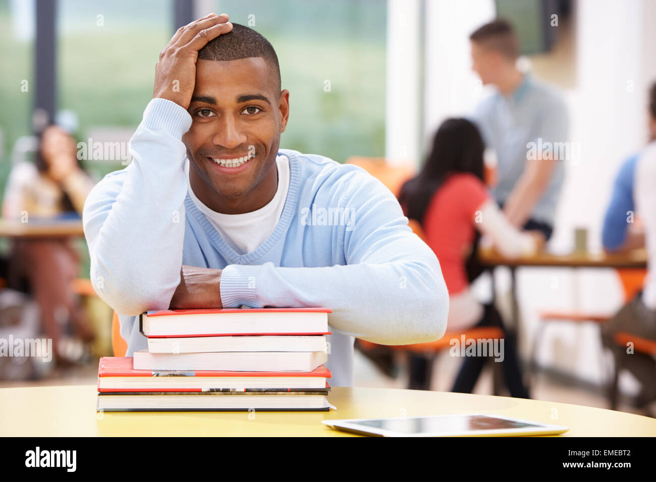 Male Student Studying In Classroom With Books Stock Photo - Alamy