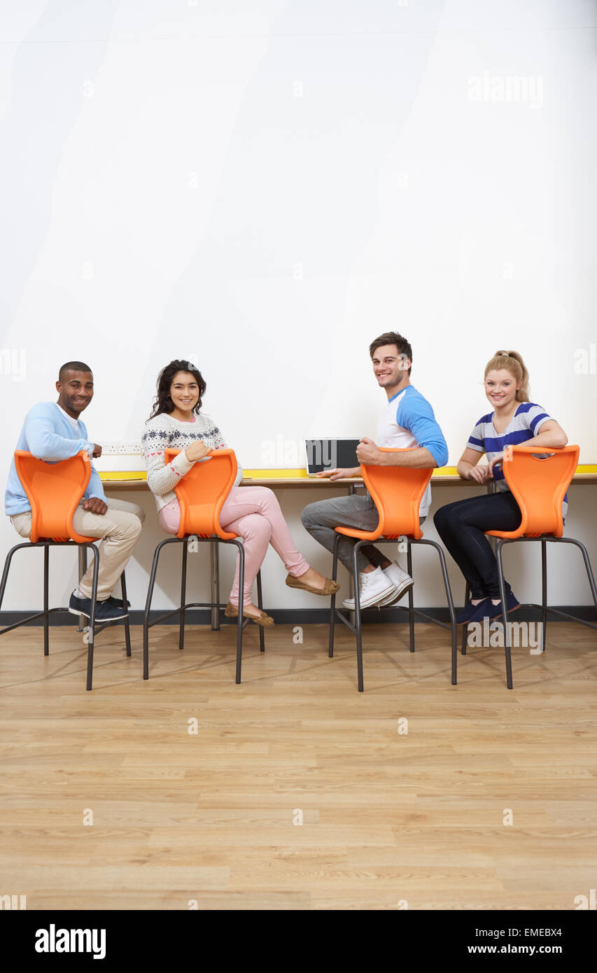 Group Of College Students Working At Desk Together Stock Photo - Alamy